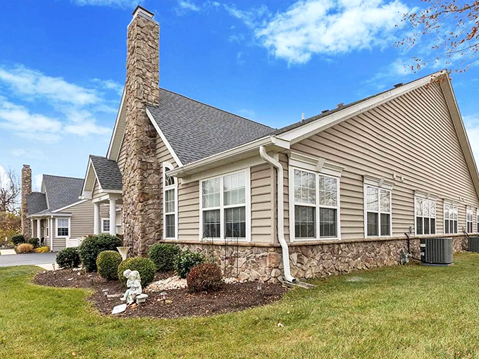 Stone and siding combo that says "distinguished" without shouting "look at me!"
