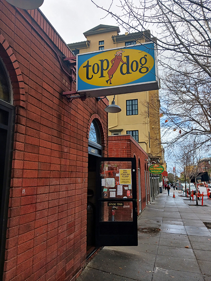 The iconic yellow sign has guided hungry students and locals to hot dog nirvana for decades.
