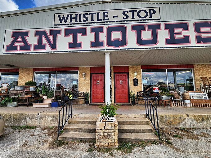 Twin red doors welcome you to this charming roadside attraction. The weathered porch displays are just appetizers for the feast of finds inside!
