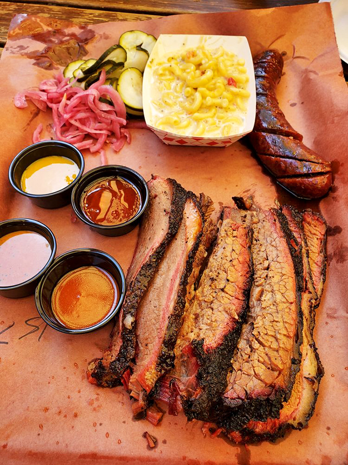 A barbecue duet that hits all the right notes. Sausage and brisket performing a smoky symphony with pickled accompaniments.