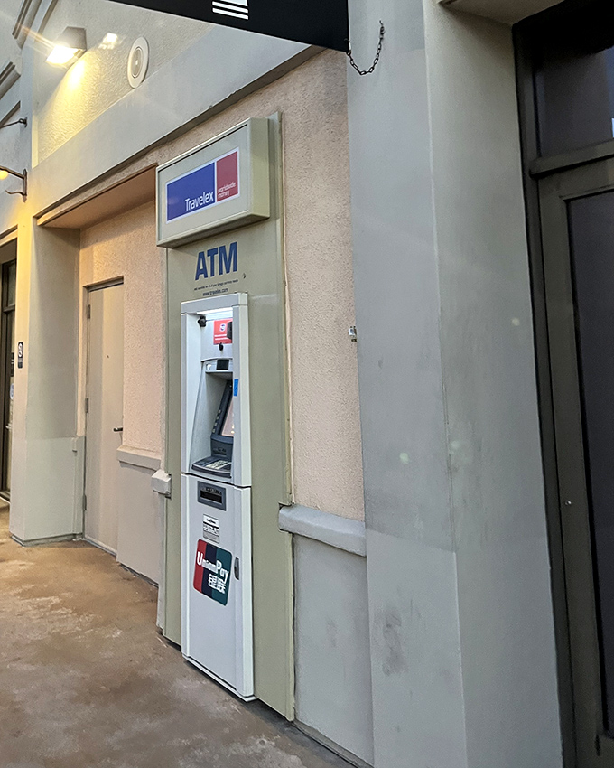 The ATM: retail's necessary evil and the silent enabler of "just one more store." Its presence is both a blessing and a danger zone for budget-conscious shoppers.