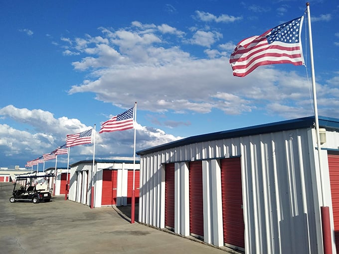 Even storage facilities get the patriotic treatment in Porterville, where American flags flutter above the mundane business of keeping extra stuff.