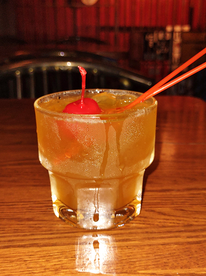 An Amaretto Sour that's both nostalgic and perfectly executed &ndash; the maraschino cherry isn't just garnish, it's the exclamation point on a liquid poem.