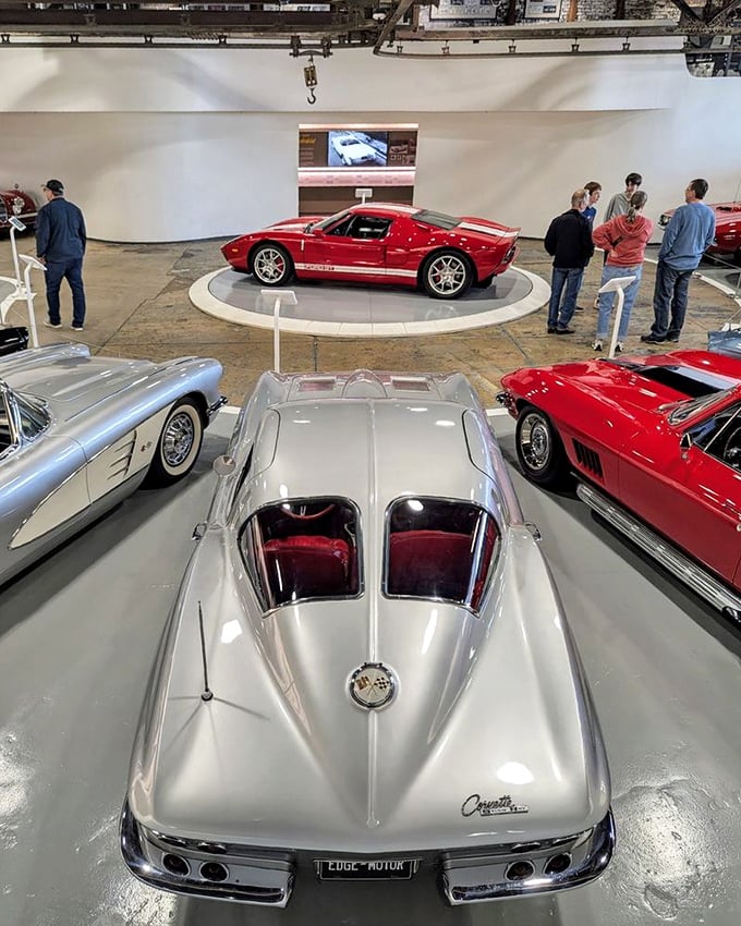 Visitors gather around automotive royalty, with the split-window Corvette commanding attention like the automotive celebrity it rightfully remains decades later.