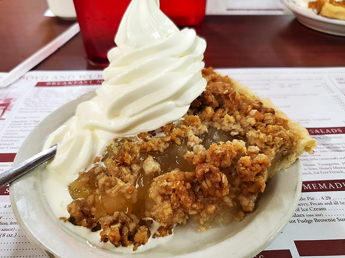 Apple pie that's having an identity crisis as a crumble. That whipped cream isn't just a topping&mdash;it's the cloud you'll float away on.