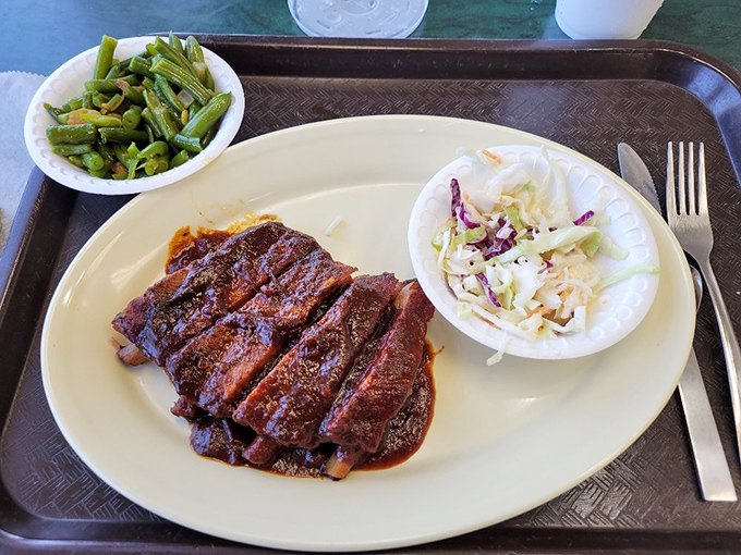 Brisket sliced thick with just enough sauce to complement, not hide. Those sides aren't afterthoughts&mdash;they're supporting actors in a meaty drama.
