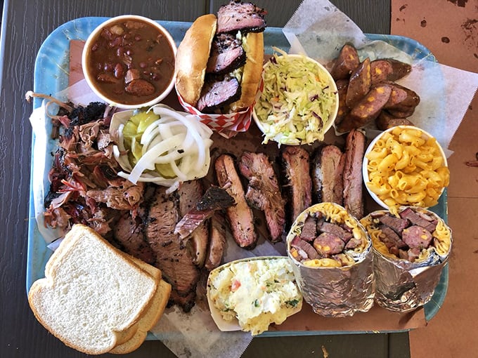The barbecue sampler that makes decisions unnecessary. Why choose between brisket, ribs, and sides when you can have the whole experience?