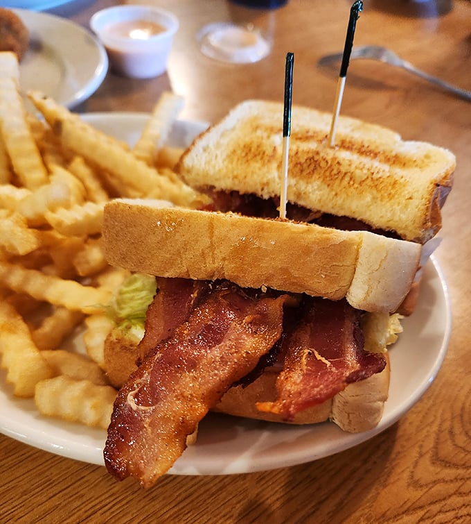 The BLT &ndash; where bacon doesn't just participate, it stars in the show. Those toothpicks aren't decoration; they're structural support for greatness.
