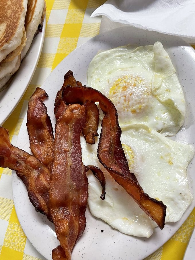 Bacon that's achieved that magical state between chewy and crisp, alongside eggs so perfectly fried they deserve their own Instagram account.