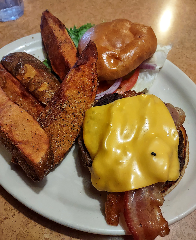 This isn't just a burger&mdash;it's architecture. Those potato wedges standing guard like delicious sentinels of crispiness deserve their own fan club.