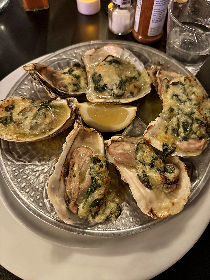 Baked oysters that look like they're wearing little cheese tuxedos to their own delicious black-tie affair.