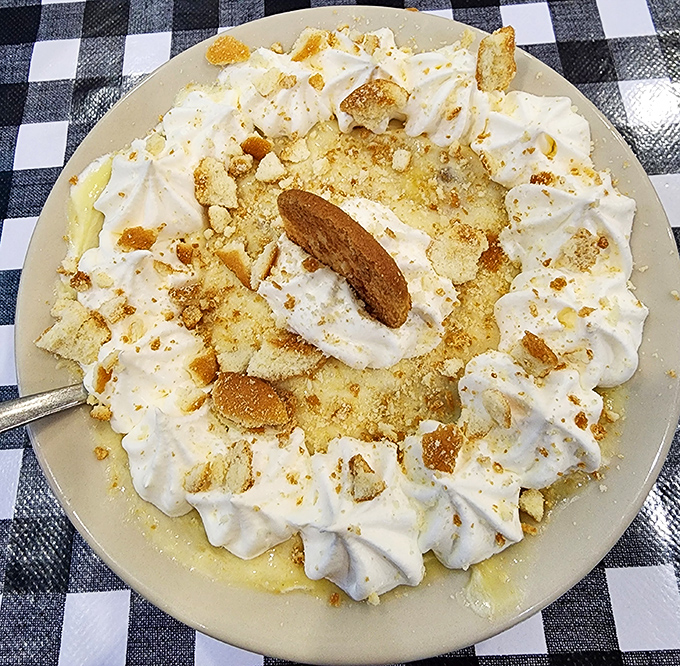 Banana pudding that would make your Southern grandmother both proud and jealous, crowned with vanilla wafers that somehow maintain their structural integrity despite the creamy deluge below.