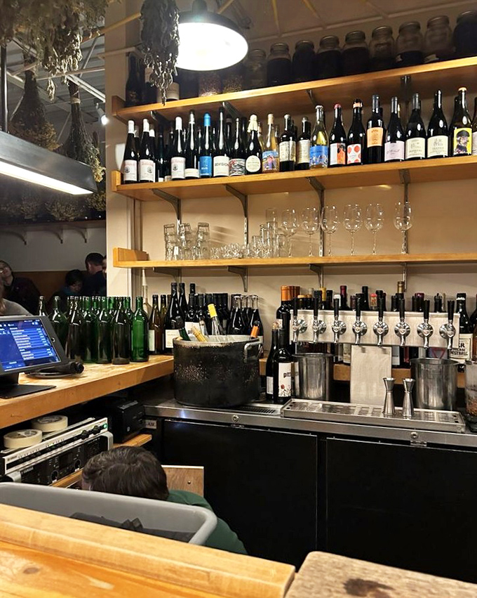 Behind Apteka's bar, bottles stand like soldiers ready for duty&mdash;natural wines and Eastern European spirits waiting to complement your plant-based feast.