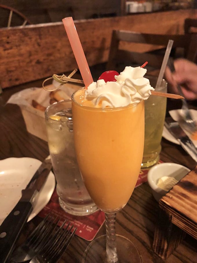 The Barn Bellini isn't just a drink&mdash;it's liquid sunshine topped with whipped cream and a cherry, proving that even cocktails dress up for dinner in Ohio.