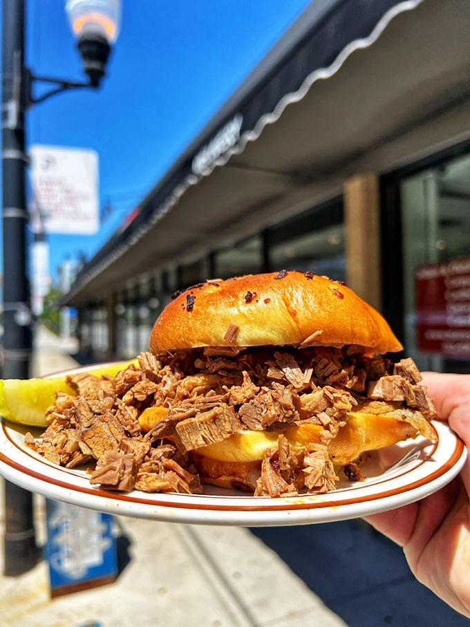 Architecture in sandwich form: this brisket creation stands taller than some downtown buildings and tastes infinitely better.
