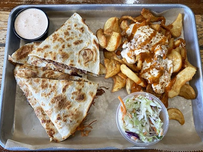 This quesadilla is what happens when brisket decides to take a vacation to flavor town. The crispy exterior gives way to smoky, cheesy perfection inside.