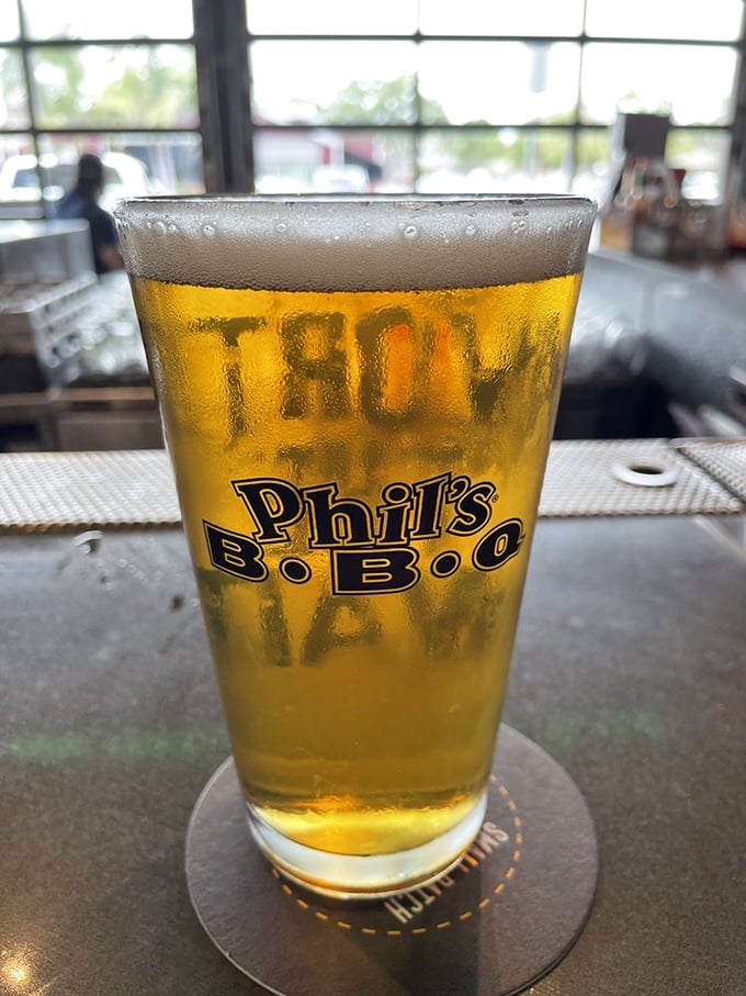 Nothing complements barbecue's smoky embrace quite like a cold beer, its condensation promising relief from the San Diego heat.