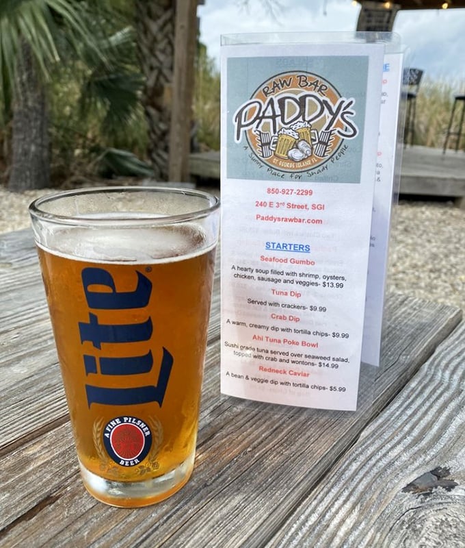 A cold Miller Lite in a proper glass with a menu of possibilities&mdash;sometimes the simplest pleasures make the best vacation companions.
