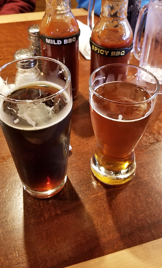 Beer and barbecue – a pairing older than sliced bread. Those sauce bottles stand ready, like condiment concierges waiting to enhance your experience.