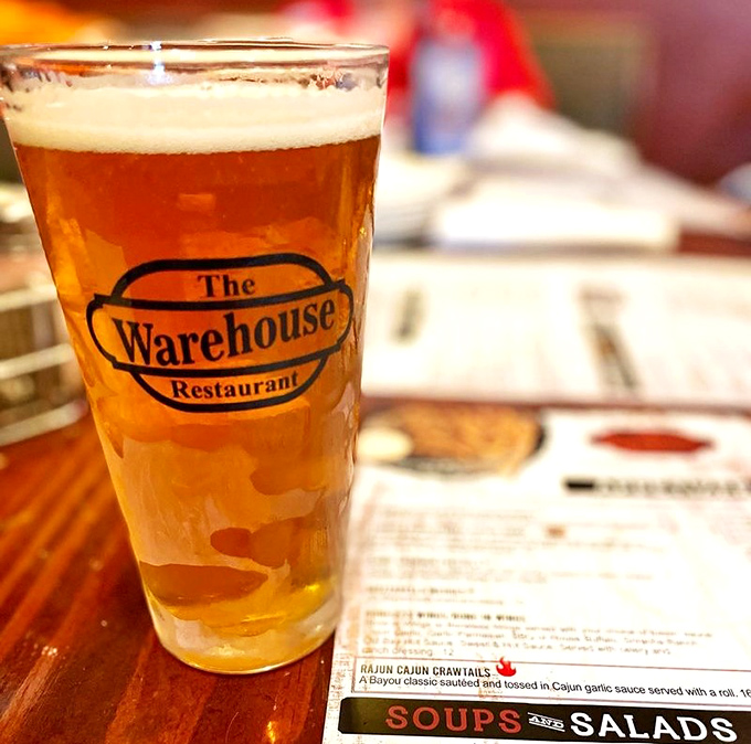 The golden glow of a cold beer in a Warehouse glass – nature's perfect companion to whatever deliciousness you've ordered.