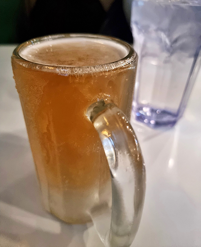 A frosty mug of beer, the perfect companion for barbecue's bold flavors. Like a loyal friend, it knows exactly when to cool things down.