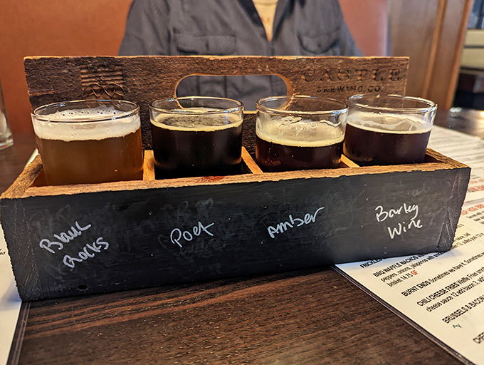 Beer flight nirvana: four distinct personalities in wooden formation. From left to right: "Try me first," "Getting interesting," "Now we're talking," and "Save for last."