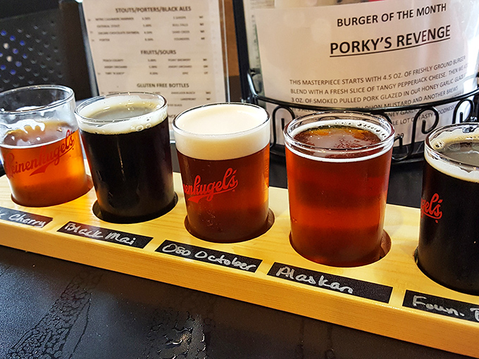 A flight of craft beers lined up like eager contestants in a delicious beauty pageant. Liquid amber treasures awaiting judgment.