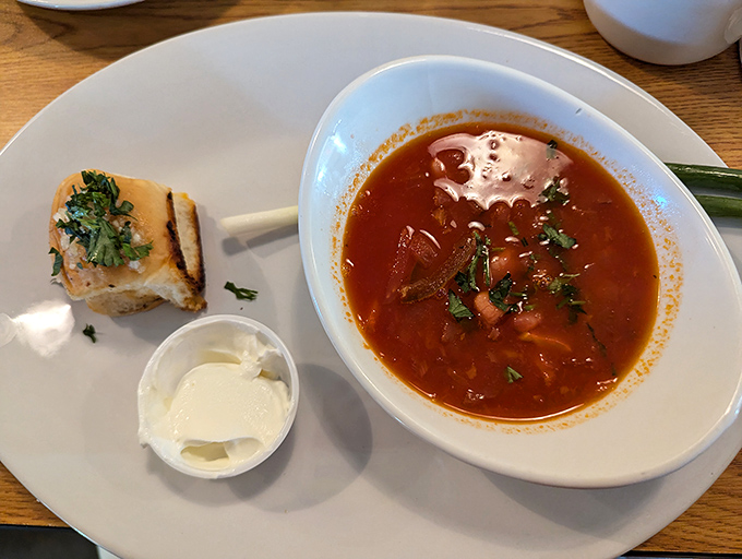 Borscht so vibrant it could double as modern art. That dollop of sour cream is the culinary equivalent of the perfect punchline.