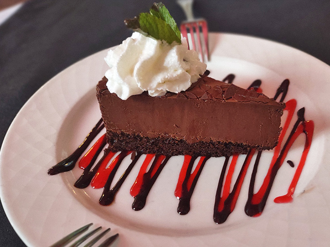 Belgian chocolate mousse cake with artistic drizzles that prove dessert can be both indulgent and Instagram-worthy simultaneously.