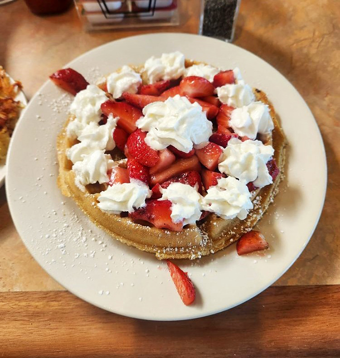 Strawberry waffle nirvana &ndash; where fresh berries, whipped cream, and golden batter create a breakfast that's basically acceptable cake.