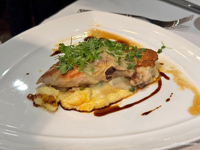 This chicken breast defies the "boring option" stereotype, resting on a cloud of creamy polenta with a sauce worth sopping up.