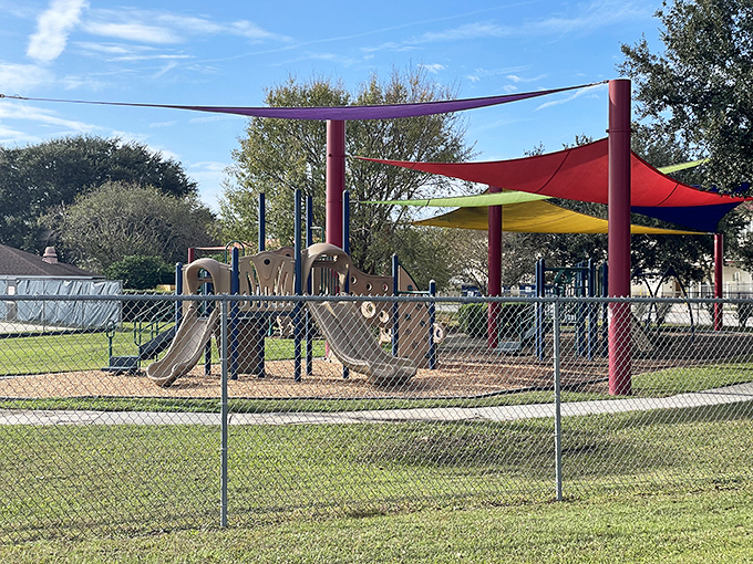 Family-friendly parks with colorful shade structures – because in Florida, playground designers understand that melanin preservation is a public service.