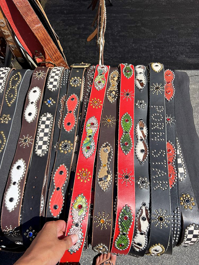 Bedazzled belts lined up like a rhinestone rodeo. That red one isn't just an accessory&mdash;it's your next conversation starter at the neighborhood barbecue.