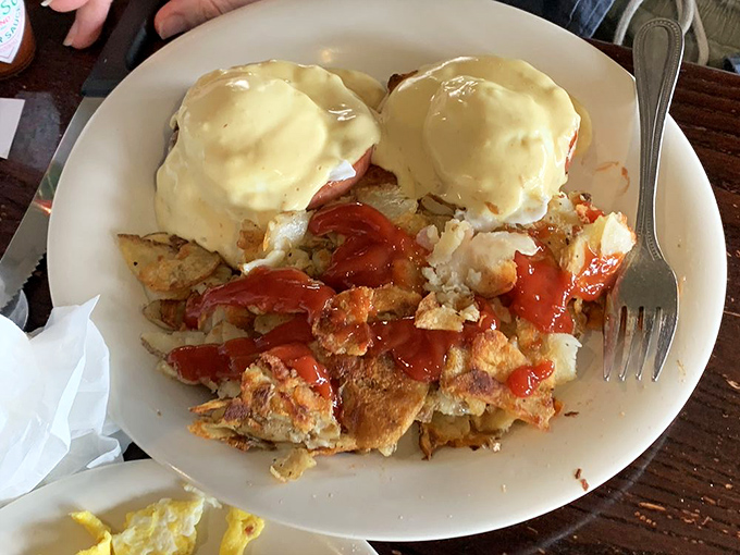 Eggs Benedict that would make the Pope himself convert to breakfast worship. Those perfectly poached eggs wear their hollandaise like royal robes.