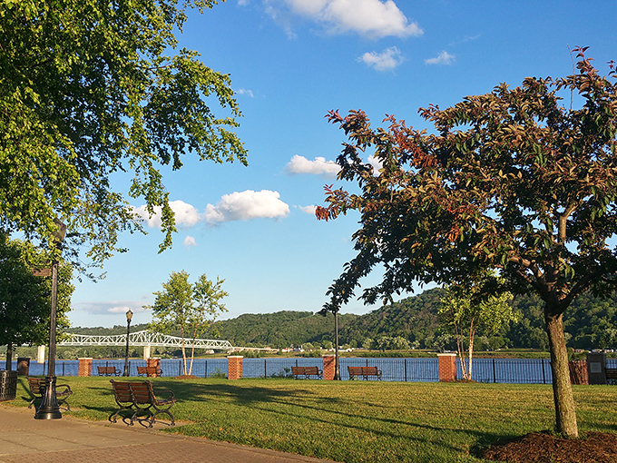 The Ohio River flows lazily past Madison's riverfront park. These benches offer front-row seats to nature's slow-motion show of barges, birds, and spectacular sunsets.