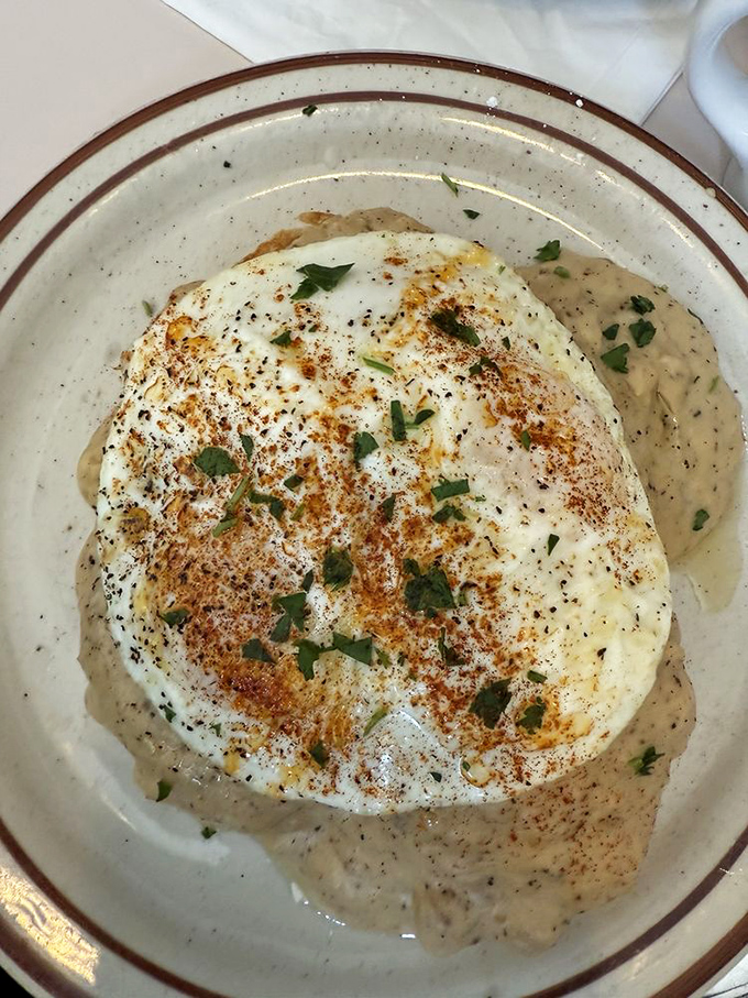 Simple pleasures done right&mdash;a perfectly poached egg nestled in herb-flecked gravy that would make your grandmother simultaneously proud and jealous.
