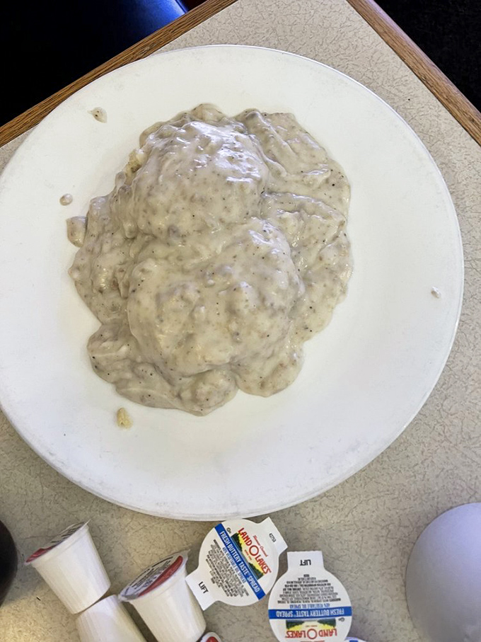 Biscuits and gravy that doesn't so much sit on the plate as command it&mdash;a creamy, peppery masterpiece that demands your full attention.