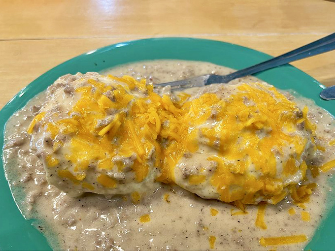 Biscuits swimming in sausage gravy with melted cheddar life rafts. Southern comfort food that hugs you from the inside out.
