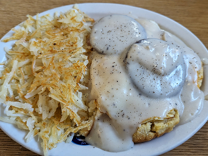 Biscuits and gravy: The South's greatest contribution to breakfast civilization. That pepper-speckled gravy blanket is comfort in edible form.