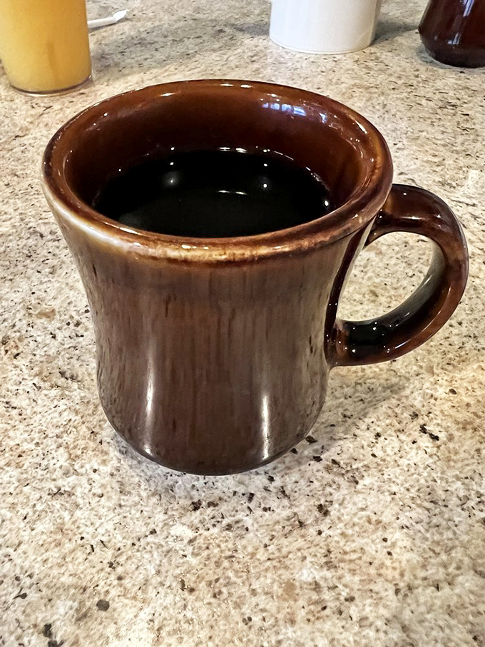 The sturdy brown mug says it all&mdash;this coffee means business. No fancy foam art needed when the brew itself delivers a perfect morning handshake.