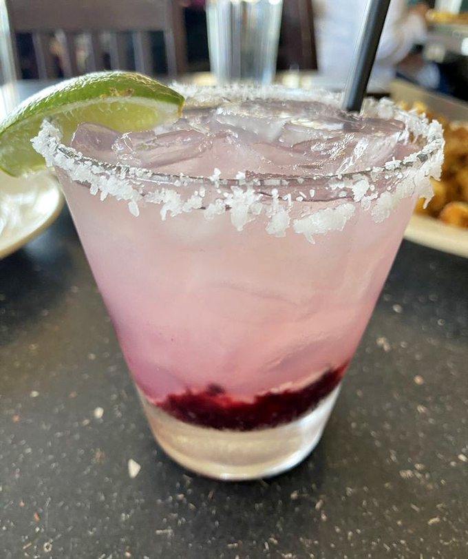 A pink margarita with a salt-crusted rim and lime wedge that promises to turn any ordinary lunch into a celebration. Vacation in a glass, Texas-style.