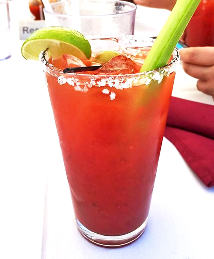 This isn't just any Bloody Mary – it's a spicy desert revelation with a salted rim that makes you forget you're miles from the ocean.