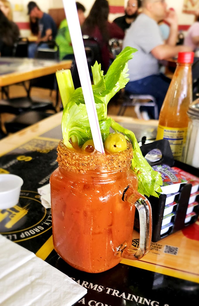 Their Bloody Mary comes dressed better than most people at the theme parks, with a celery stalk standing tall like it's guarding all that tomato goodness.