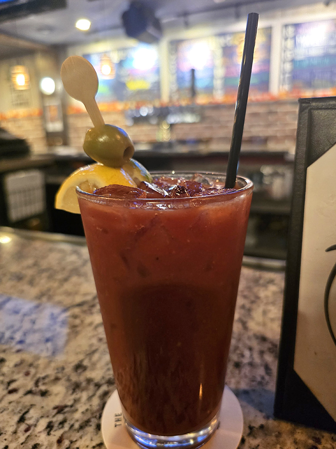 Their Bloody Mary comes dressed better than most people on a Friday night, with an olive spear that means serious cocktail business.