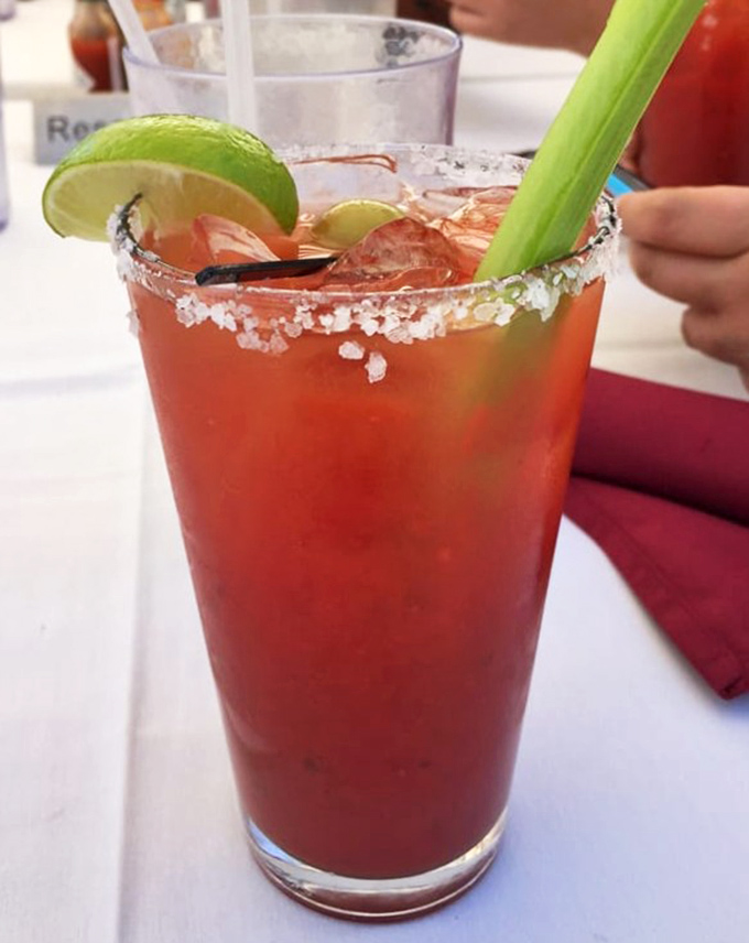 This isn't just a Bloody Mary; it's a liquid salad with attitude, sporting a salt necklace and celery walking stick.
