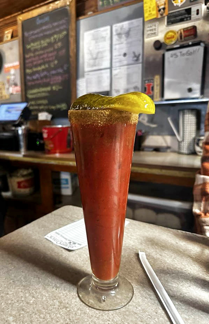 A Bloody Mary tall enough to have its own ZIP code. That pickle spear isn't a garnish&mdash;it's a diving board into a pool of savory morning redemption.