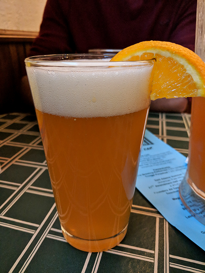 Blue Moon Belgian White garnished with orange &ndash; because even wing joints know how to elevate beer service.