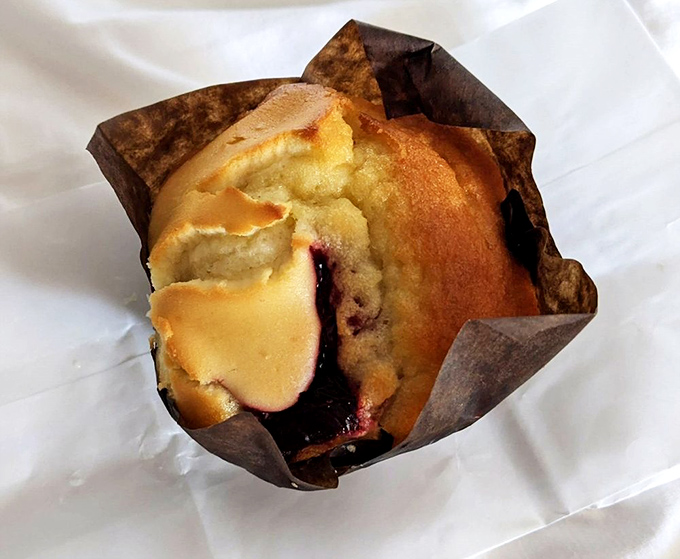 This blueberry cream cheese muffin looks like it graduated summa cum laude from the university of "things that make mornings worth waking up for."