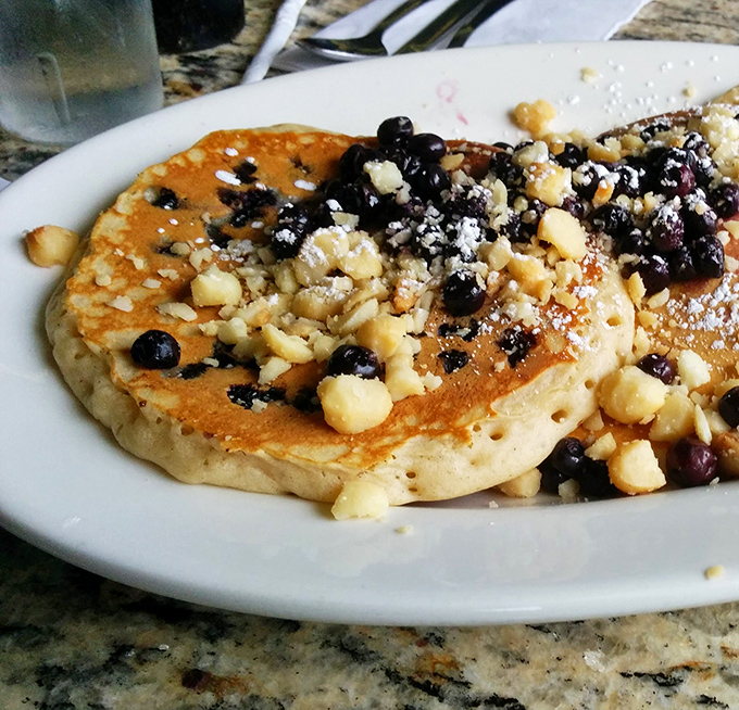 Pancakes studded with blueberries like edible polka dots, because breakfast should be fun.