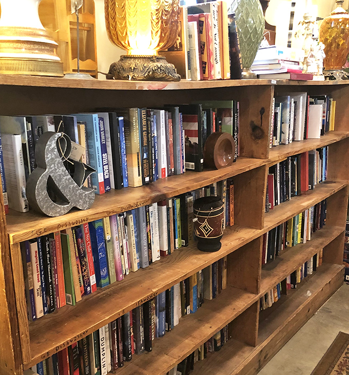 Books organized with the care of a librarian but the soul of a collector. Literary treasures await between these wooden shelves.